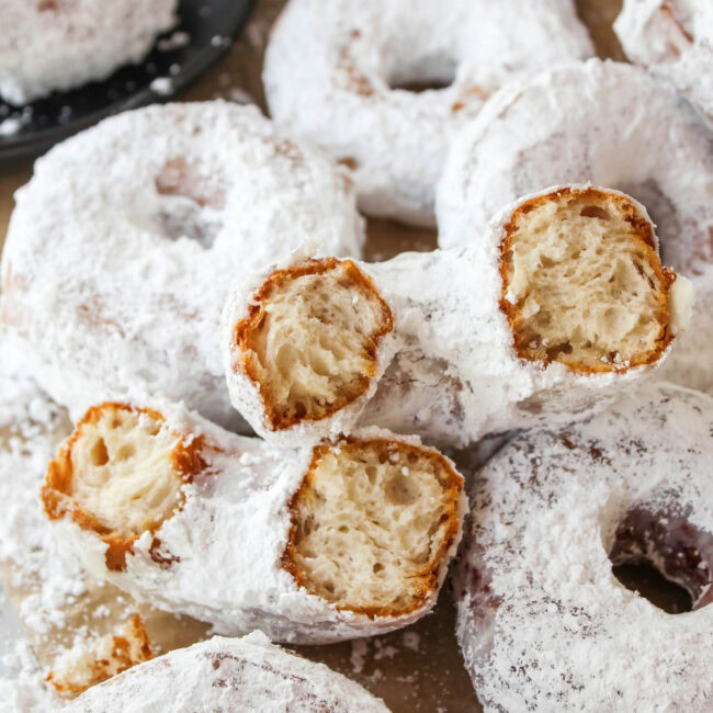 Powdered Sugar Canned Biscuit Donuts - Baking You Happier